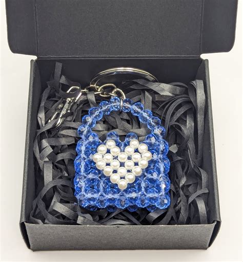 ბართი ბრელოკი ცისფერი ჩანთა თეთრი მარგალიტის გულით Veli Store