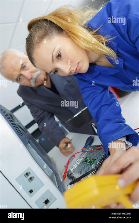 Woman Measuring Electrical Current Stock Photo Alamy