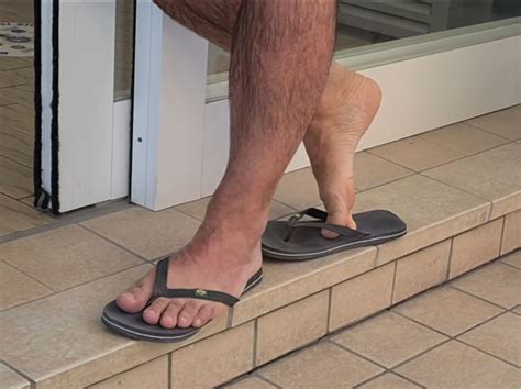 Barefoot In Black Flip Flop