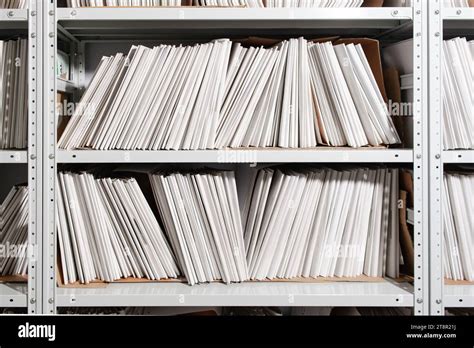 Shelves With Paper Documents Organized Office Space With Neatly Arranged Paper Documents And