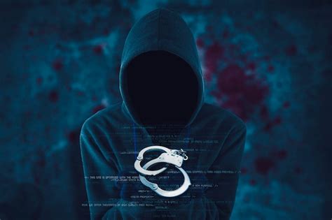 Premium Photo Hooded Hacker Showing A Handcuffs On His Hands