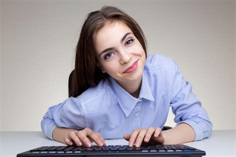 Premium Photo Smiling Girl Using Keyboard