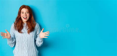 Excited Redhead Woman Shaking Hands Explaining Big News Staring At Camera Amazed Standing