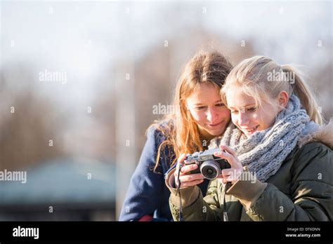 Teenage Girls Using Camera Stock Photo Alamy