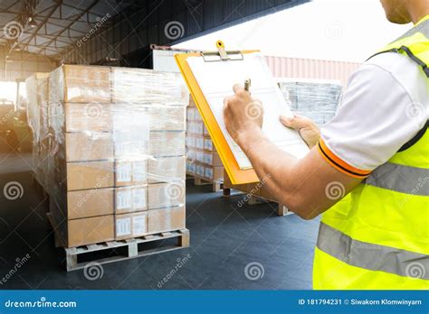 Warehouse Worker Courier Hand Holding Clipboard Inspecting Load Shipment Goods Stock Image
