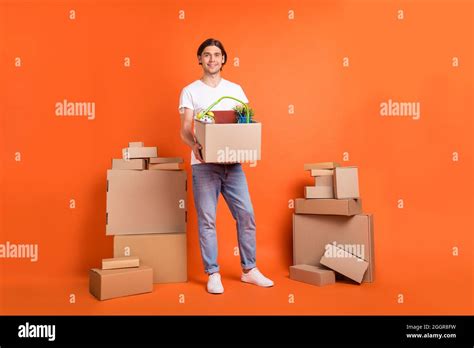 Full Body Photo Of Happy Positive Cheerful Man Hold Hands Move Boxes
