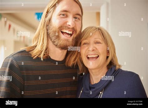 Portrait Of Mature Blond Woman And Adult Son At Home Stock Photo Alamy