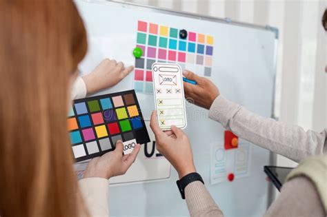 Ux Developer And Ui Designer Brainstorming Interface Wireframe Design