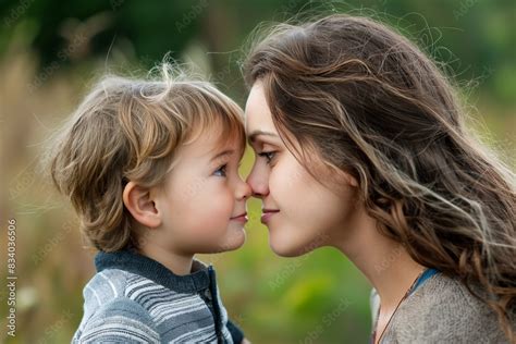 Affectionate Mother Touching Noses With Her Young Son Affectionate