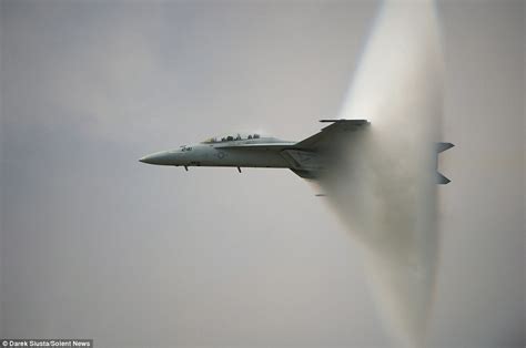 Stunning Photos Capture Fighter Jet As It Creates A Vapour Cone Around