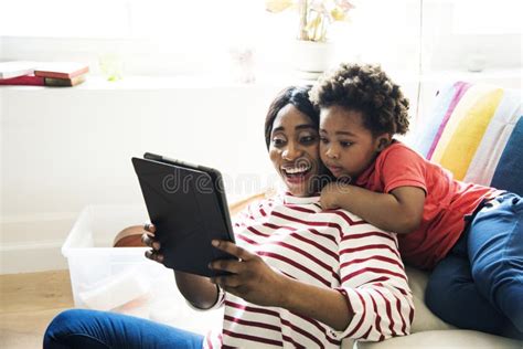 Mom And Son Using Tablet Together Stock Image Image Of Parenthood Smile 107856115