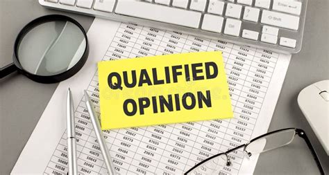 Qualified Opinion Text Written On A Sticky On Chart With Keyboard And