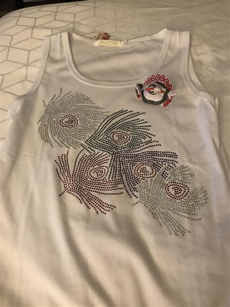I Somehow Managed To Find A Tank Top With Shens Feathers On It At A