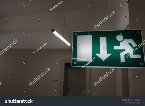 Green Illuminated Emergency Exit Sign Wall Stock Photo 2141480421 Shutterstock