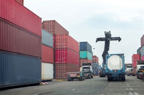 Premium Photo Container And Crane Lift Up Container Loading To Container Depot