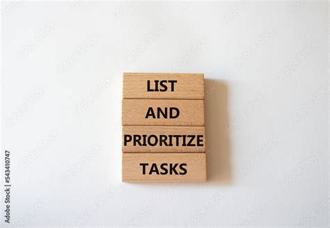 List And Prioritize Tasks Symbol Concept Words List And Prioritize Tasks On Wooden Blocks