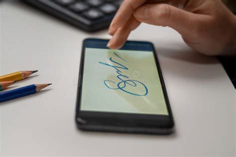 A Woman Signs A Distance Contract In A Mobile Phone Electronic