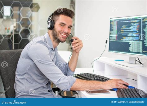 Programming Smiling Handsome Man Working On Computer In It Company Sitting At Desk Writing