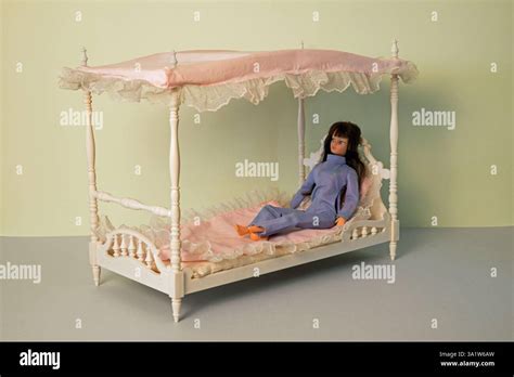 S Action Girl Doll Lying On Her Four Poster Bed Wearing A Blue
