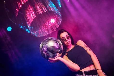 Beautiful Young Girl Have Fun Dancing In The Night Club Holding Party