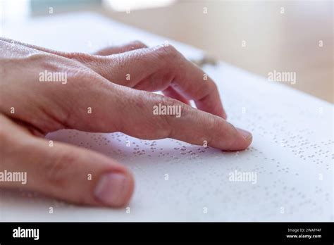 Blind Or Visually Impaired Person Reading A Book Printed With Braille Characters Stock Photo Alamy