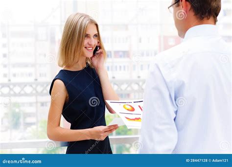 Business Man And Business Woman Discuss Reports Stock Photo Image Of Person Analysing 28447128