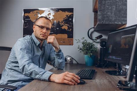 Premium Photo Adult Professional Video Editor Using Footage Software On Computer Monitors