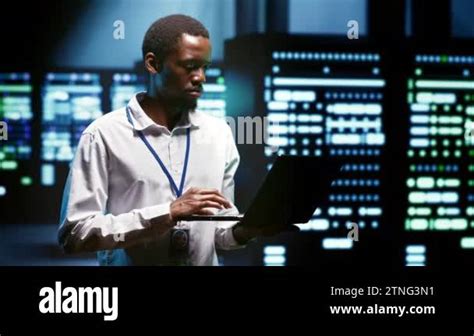 Computer Scientist Using Tablet To Analyze Server Cabinets Providing Computing Resources And