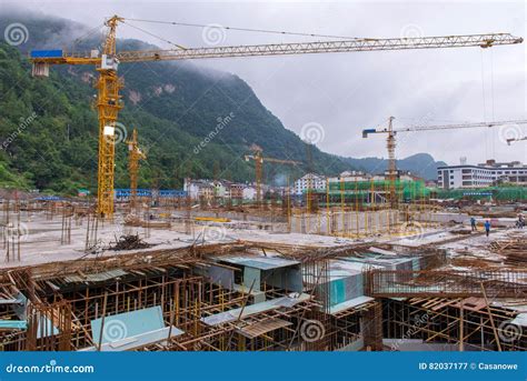 Crane And Workers At Building Construction Site In Progress Stock Image