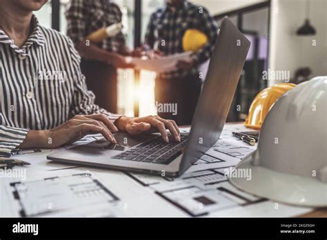 Professional Architect Designer Structural Engineer Team Colleagues Discussing Building Plan