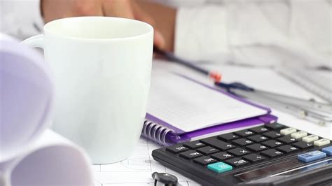 focused man calculate to project plan cost and write data in notebook