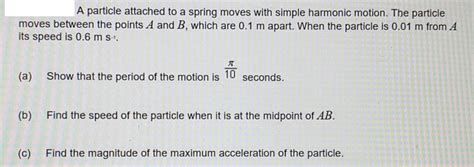 Solved A Particle Attached To A Spring Moves With Simple Chegg