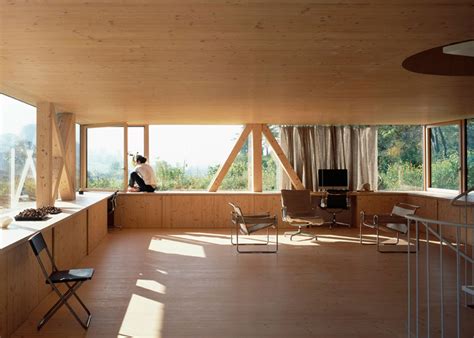 Swiss House By Pascal Flammer With Wooden Braces And A Circular Window