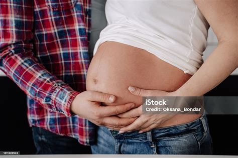 Pregnant Woman And Man Couple Hands Fondle Abdomen Stock Photo - Download Image Now - Abdomen ...