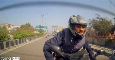careless bajaj pulsar rider crashes into the rear of a car caught on