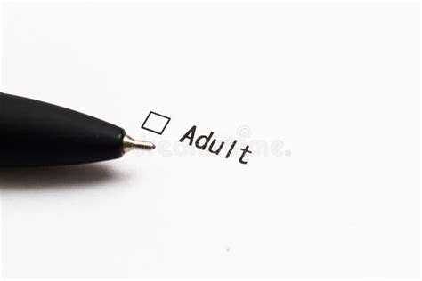 Pen And The Inscription Adult With A Check Mark On White Paper Questionnaire Stock Image