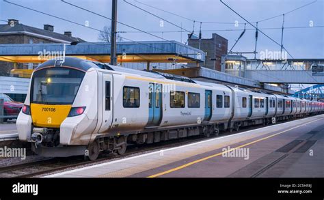 Thameslink Class 700 Passenger Train Waiting At A Railway Station In
