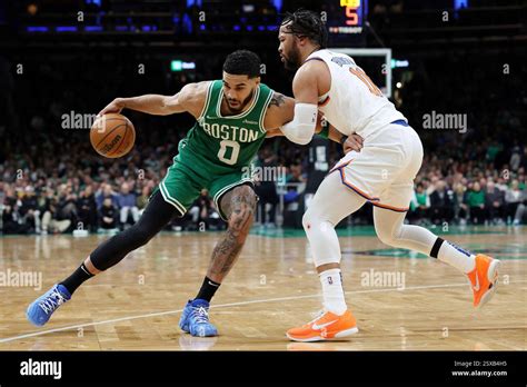 Boston Celtics' Jayson Tatum (0) looks to move past New York Knicks' Jalen Brunson (11) during ...