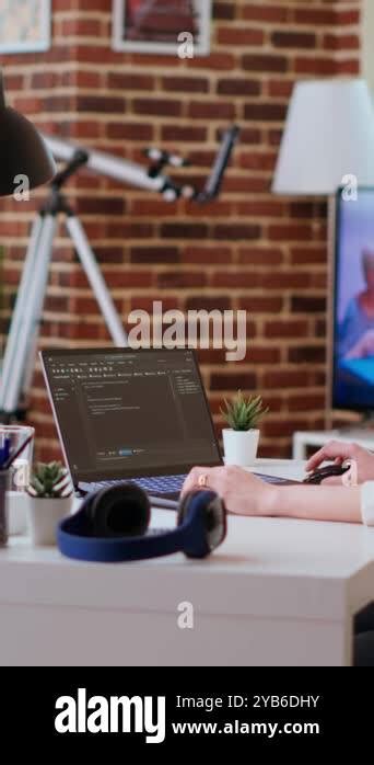 Vertical Video Software Developer Types Programming Code In A Cozy Home Office Setup Asian