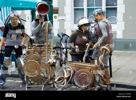 Musicians Taking Part In Street Theatre Using Improvised Instruments