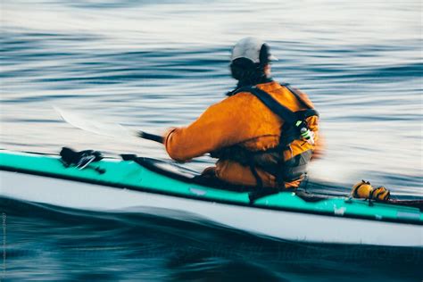 Man Sea Kayaking In Puget Sound Blurred Motion By Stocksy