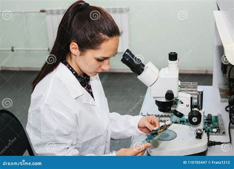 Beautiful Female Computer Expert Professional Technician Examining