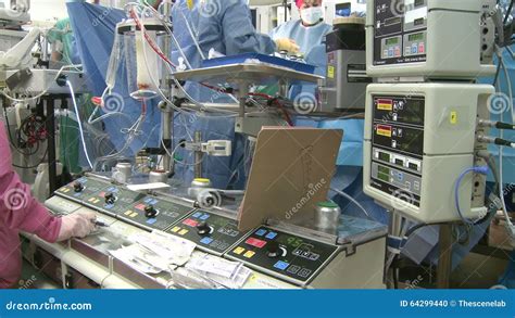 Heart Lung Bypass Machine With Surgical Team In Background Stock