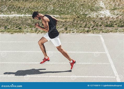 Side View Of Male Sprinter Running On Athletic Track Stock Image Image Of Cardio Sprinter