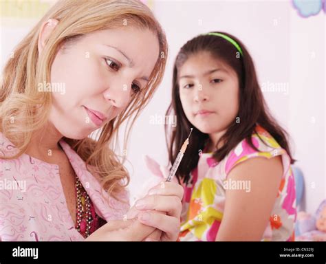 Doctor Checking Her Syringe Before Putting The Patient Stock Photo Alamy