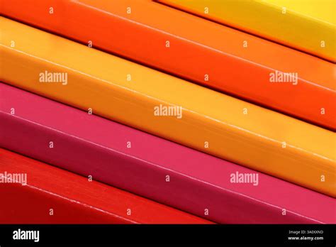 A Visually Striking Arrangement Of Vibrant Paper Sheets In Shades Of Yellow Orange And Pink