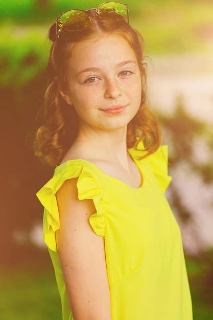 Premium Photo Portrait Of A Redhaired Girl In A Yellow Dress In Nature In The Summer At Sunset