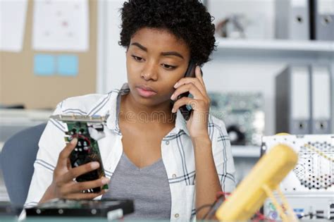 Female Worker Fixing Device In Electronics Workshop Stock Image Image