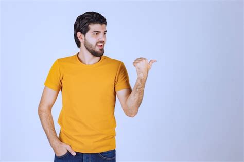 Free Photo Man Pointing Something In The Behind