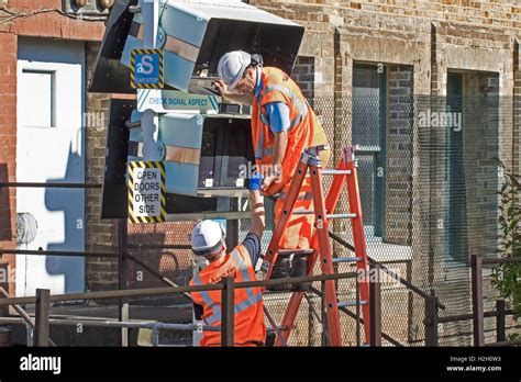 Network Rail Engineers Working On Signalling Equipment Maintenance At Londons Peckham Rye